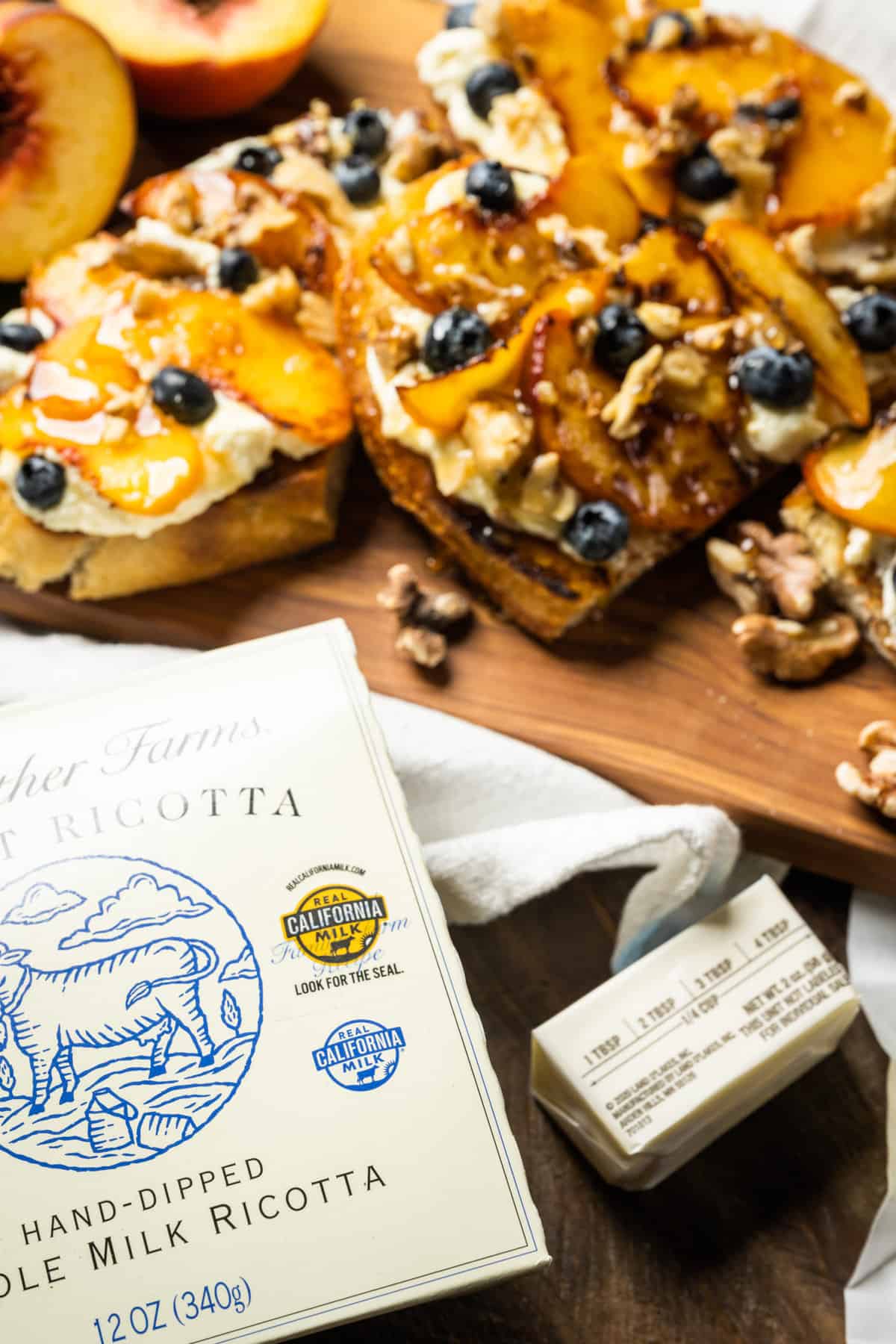 Ricotta Toast with Warmed Peaches, Honey, Blueberries and Walnuts